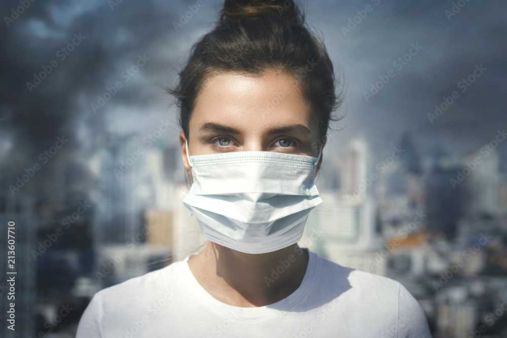 Woman wearing face mask because of air pollution in the city Stock ...