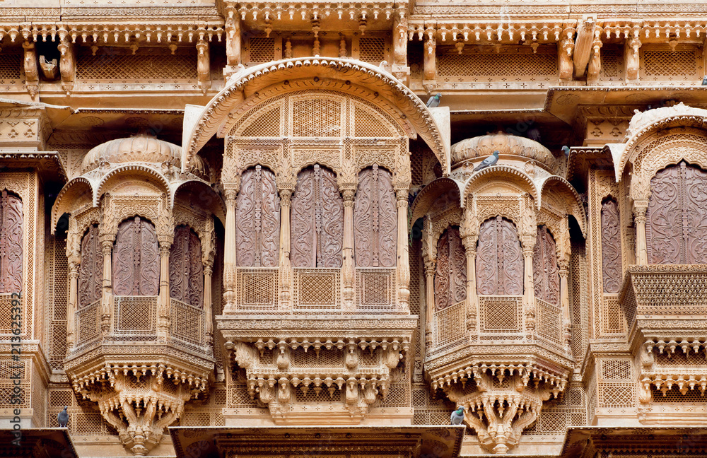 Stone balcony and carved windows of ancient stone fortress, Rajasthani ...