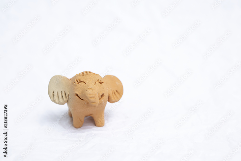 Cute little elephant clay doll isolate on white background, happy ...