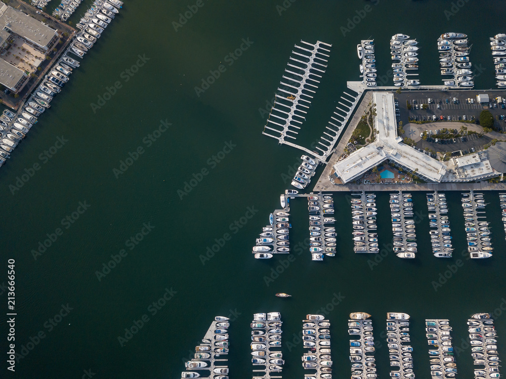 Boats aligned in a triangular shape with open water between boats on ...