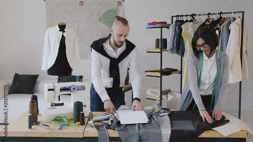 Stockvideon The designer of clothes and dressmaker develops a new ...