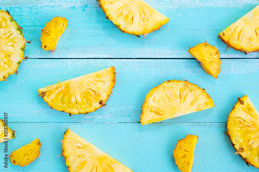 Tropical pineapple slices on wood plank blue color. frame layout summer ...