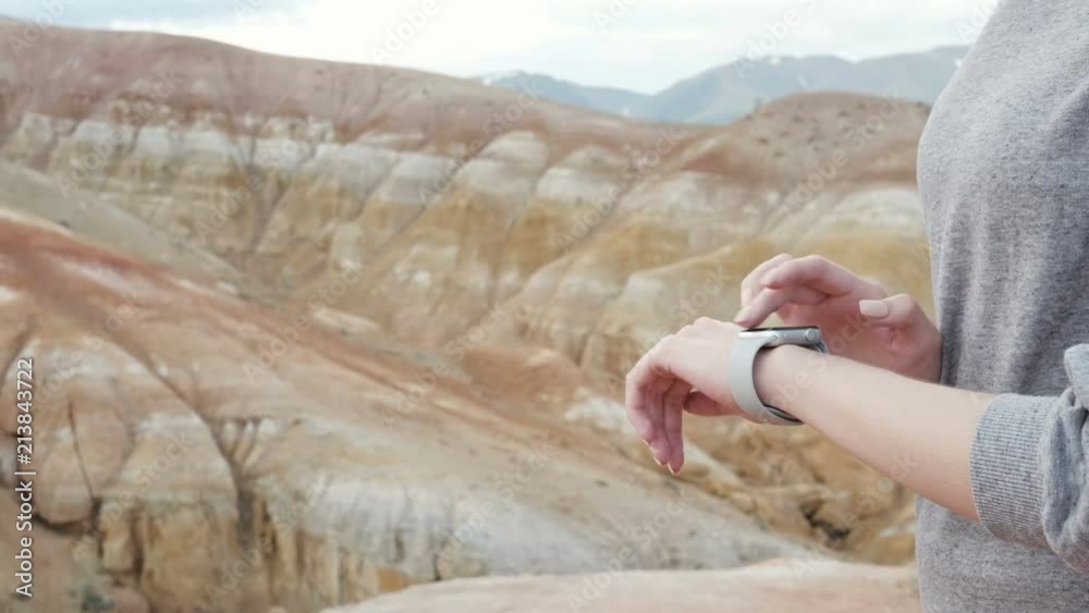 Woman using smartwatch touchscreen wearable technology device. Closeup ...