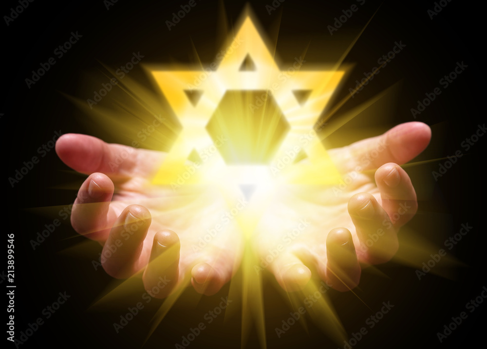 Hands cupped and holding or showing the Star of David. Magen David or ...