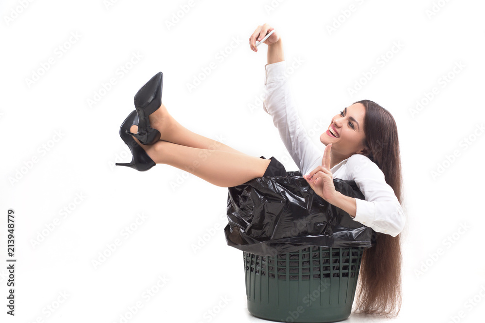 Cheerful lady sits in garbage can and takes selfies. Dorky female ...