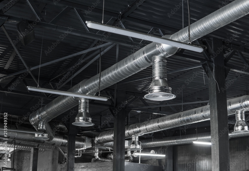 Ventilation system on the ceiling of large buildings. Ventilation pipes ...