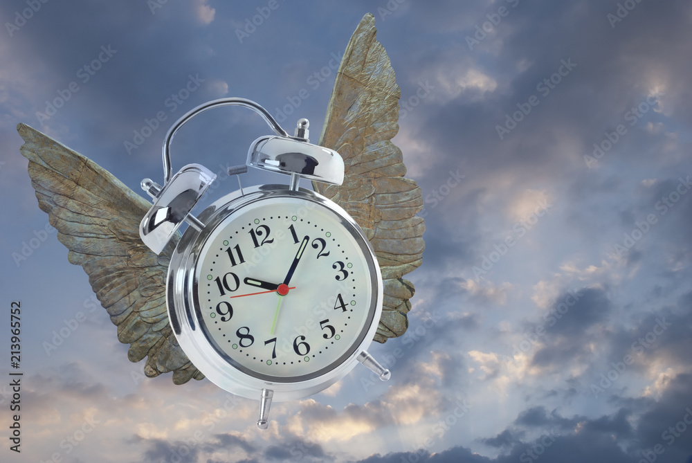 Time flies concept Clock with wings flying away Stock Photo | Adobe Stock