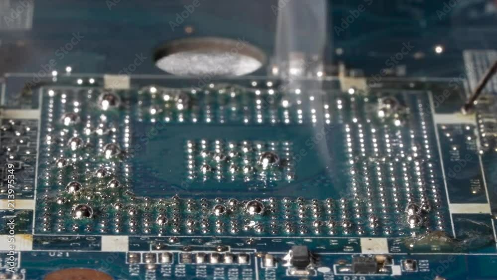 Video Stock Removing the grid array microprocessor chip from the pcb ...