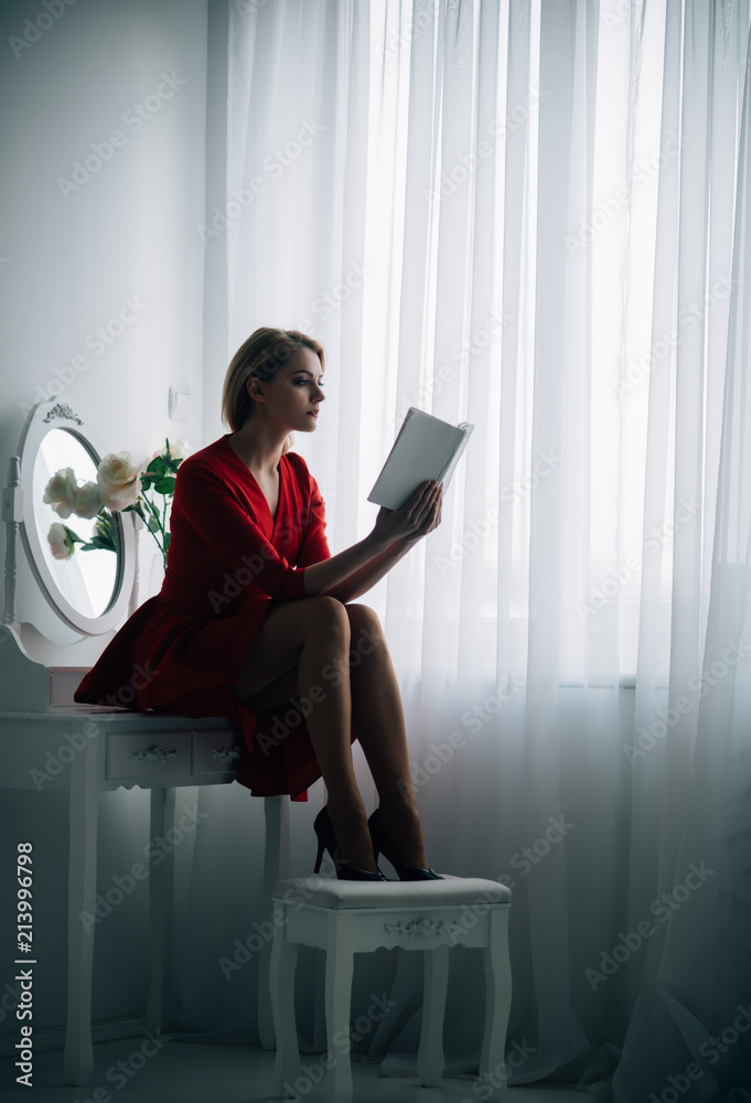 getting information. woman getting information from interesting book ...