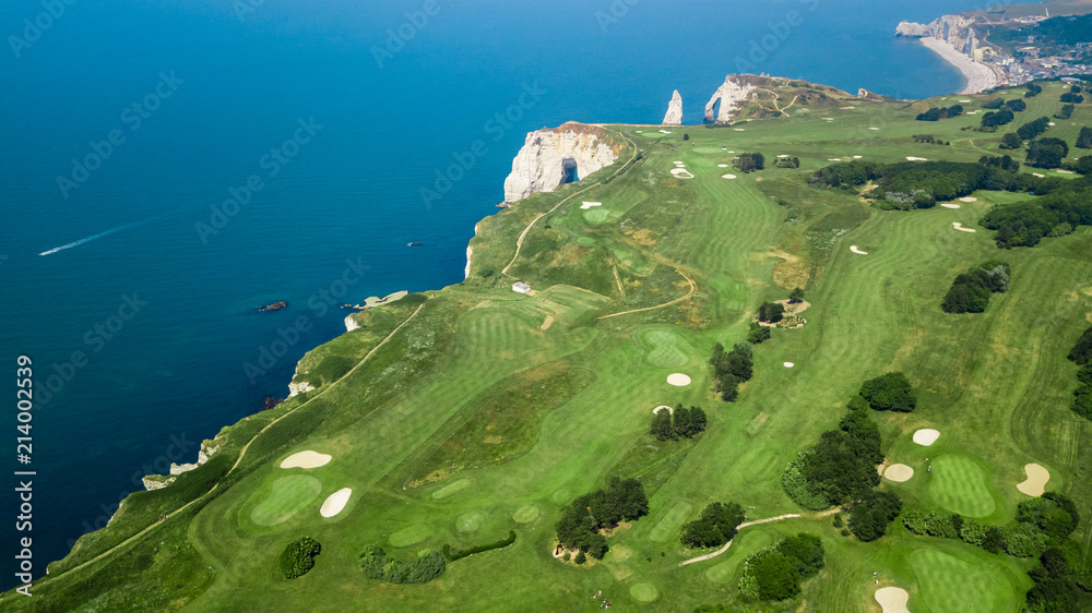 Drone view of a cliff side golf course next to the ocean in Etretat ...