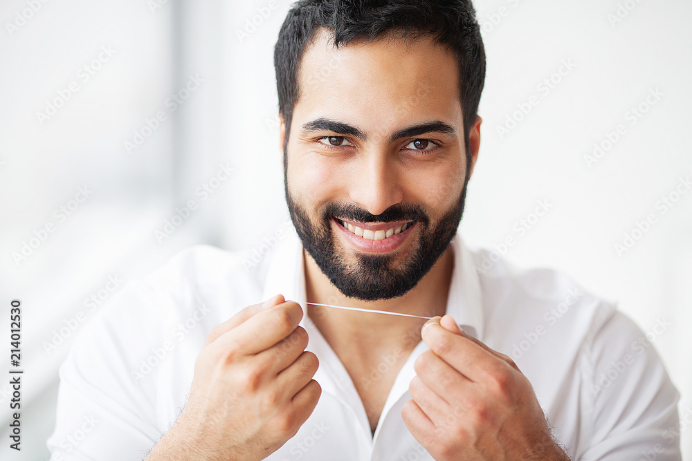 Dental Health. Man With Beautiful Smile Flossing Healthy Teeth. High ...