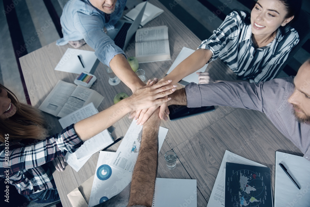 Foto Stock We are one team. Top view of a cheerful young group of ...