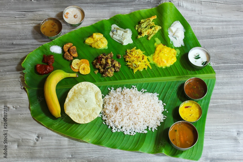 Traditionam Onam Sadya / Feast served in fresh banana leaf Stock Photo ...
