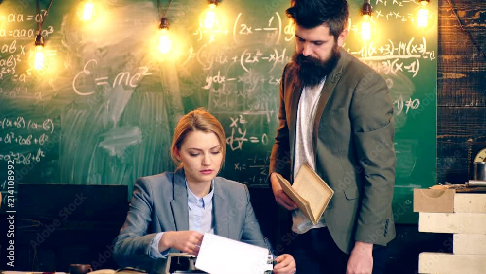 Teachers set the paper in a typewriter. Learning concept. School ...