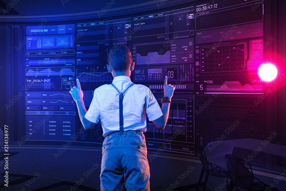 Convenient system. Clever progressive child standing opposite the ...