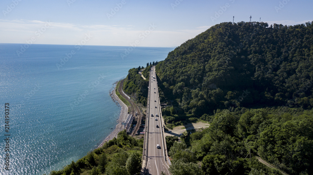Aerial stock photo of car driving along the winding mountain pass road ...