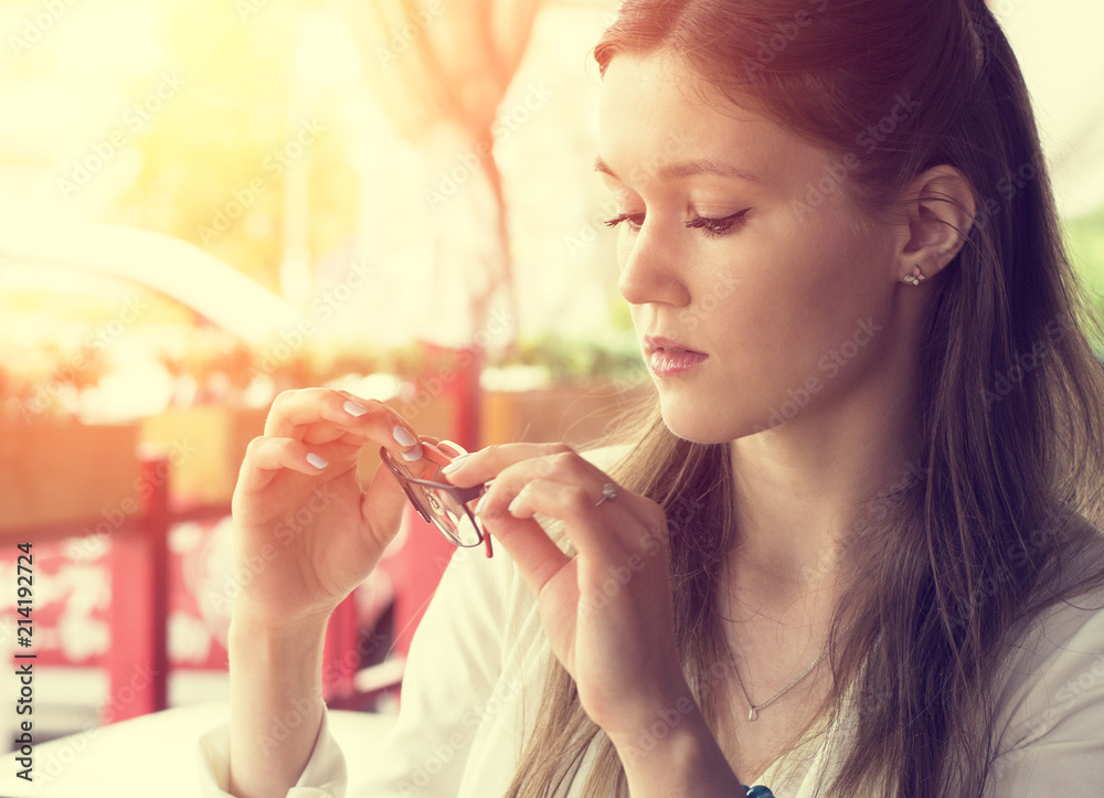 Girl Using glasses Concept. Portrait of beautiful lady using glasses at ...