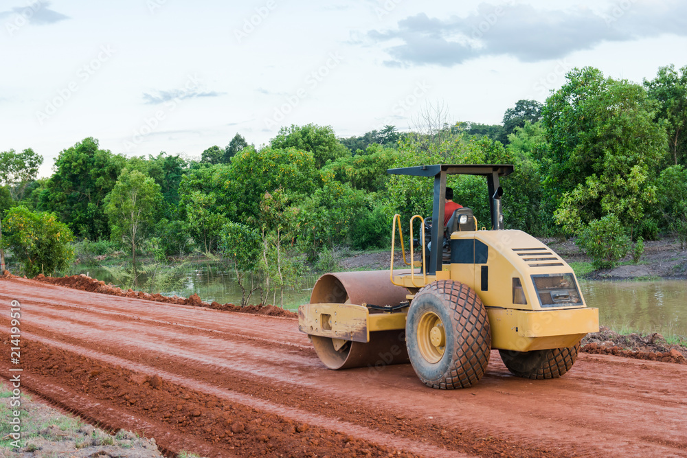 Roller steamroller or vibratory roller machine working on road ...