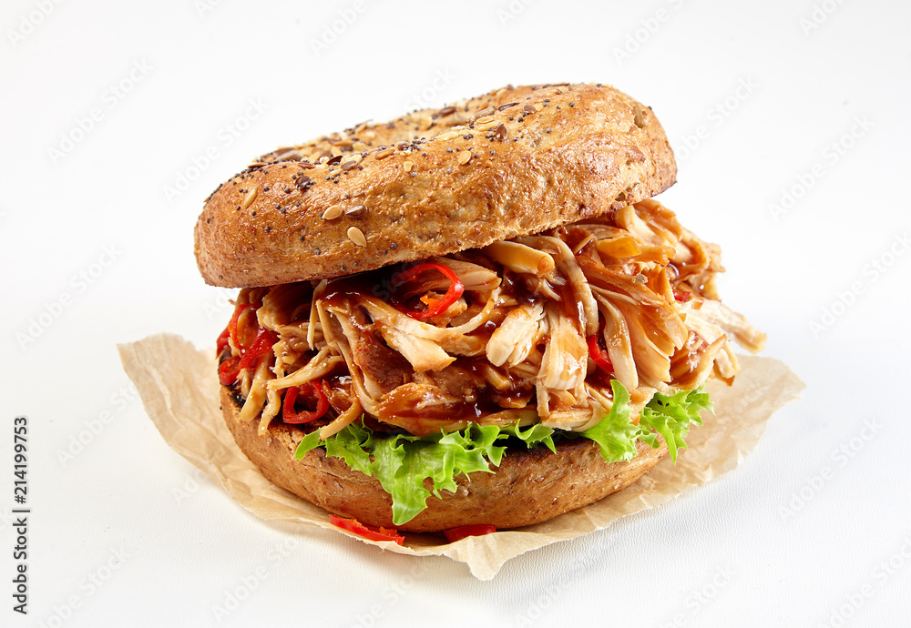 Pulled chicken kebab burger on a wholegrain bun Stock Photo | Adobe Stock