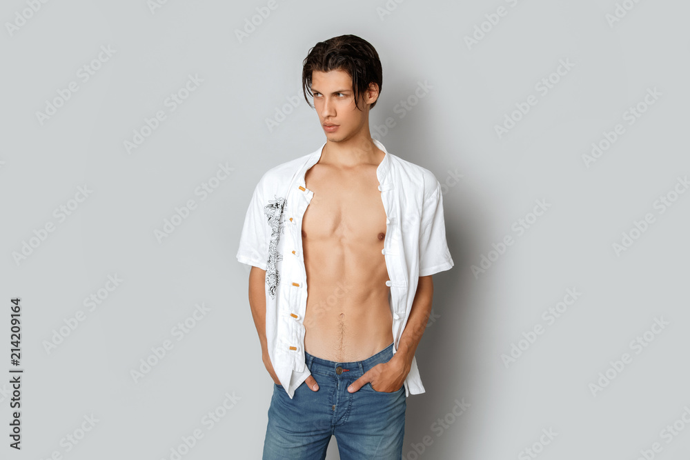 Strong face male model in casual style in white t sirt and jeans on ...