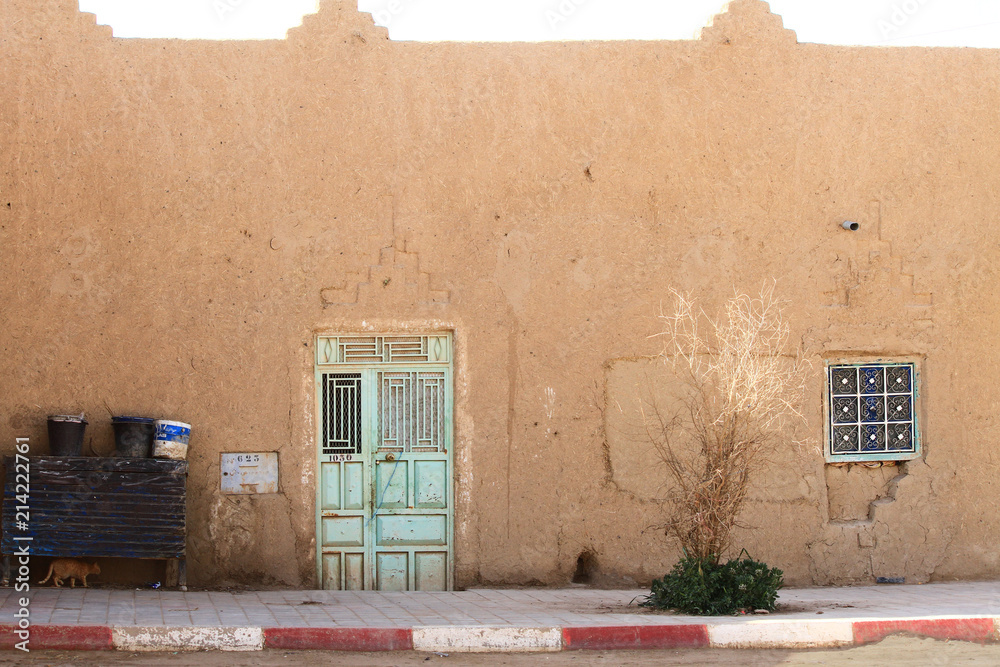 Sahara architecture. Village house with steel pistachio door in the ...