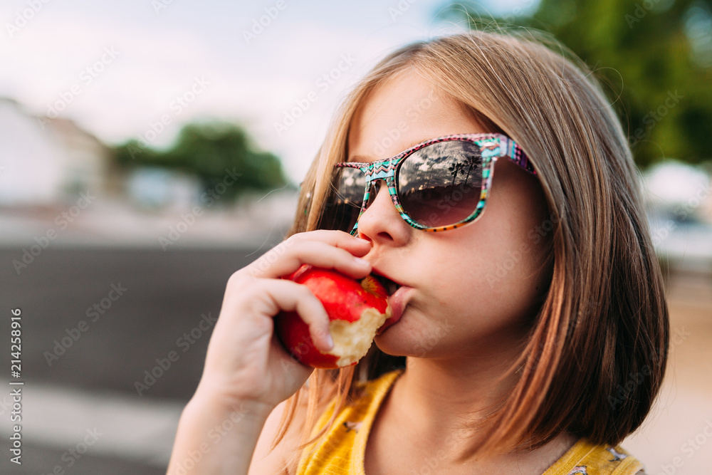 Close-up of Girl Eating Apple Stock Photo | Adobe Stock
