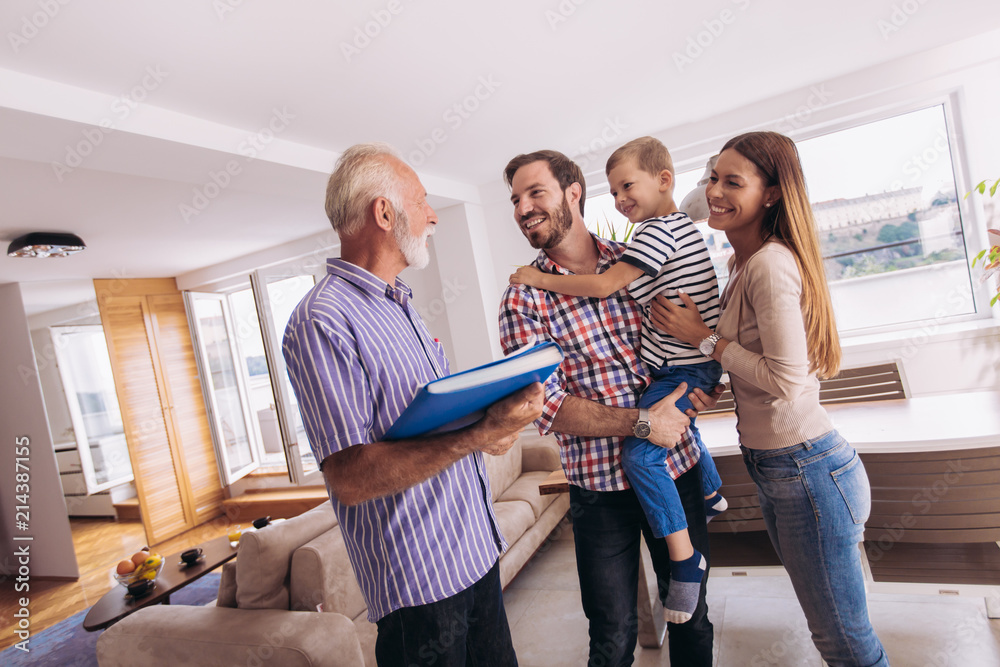 Family with real-estate agent visiting house for sale Stock Photo ...