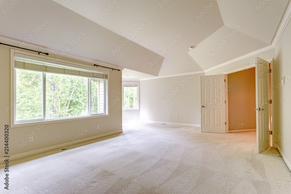 Spacious empty room interior with carpet floor. Stock Photo | Adobe Stock