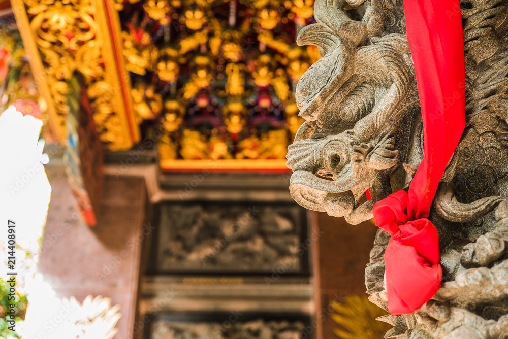 Statue of god in Chinese temple under the banyan tree in Penghu, Taiwan ...
