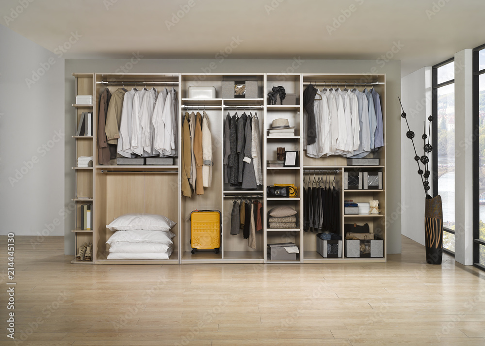 Big wardrobe with different clothes for dressing room. Interior ...