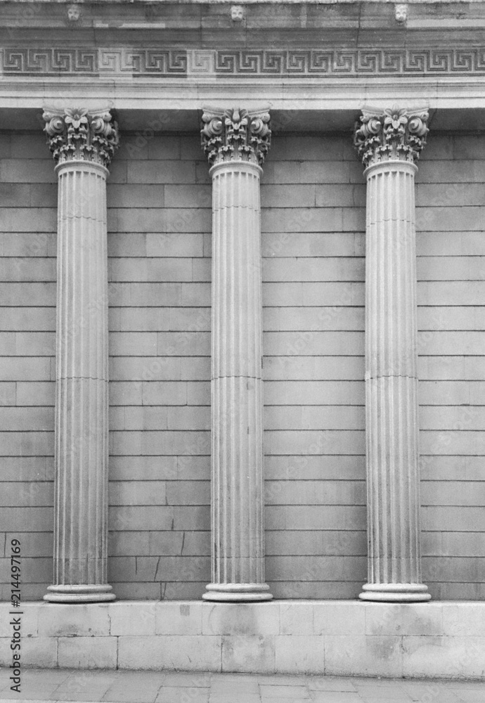 Three Corinthian columns on the exterior of a building Stock Photo ...