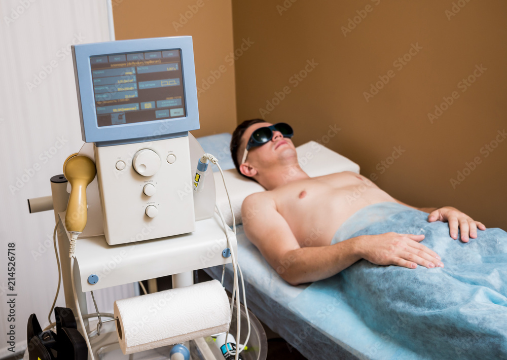 Ultrasound treatment in physical therapy. Physiotherapist doctor using ...