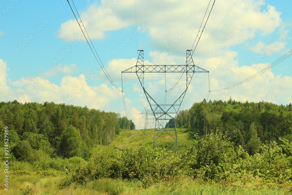 Metal poles of power lines. High-voltage direct current line. Power ...