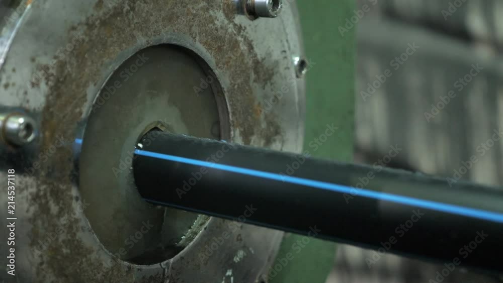 Pipes manufacturing production line. Manufacture of plastic water pipes ...