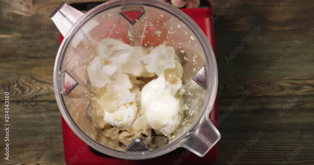 process of making frappe coffee in blender from ice, ice cream and ...