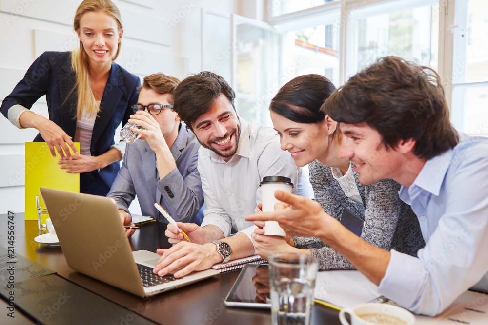 Group of business people with computer Stock Photo | Adobe Stock