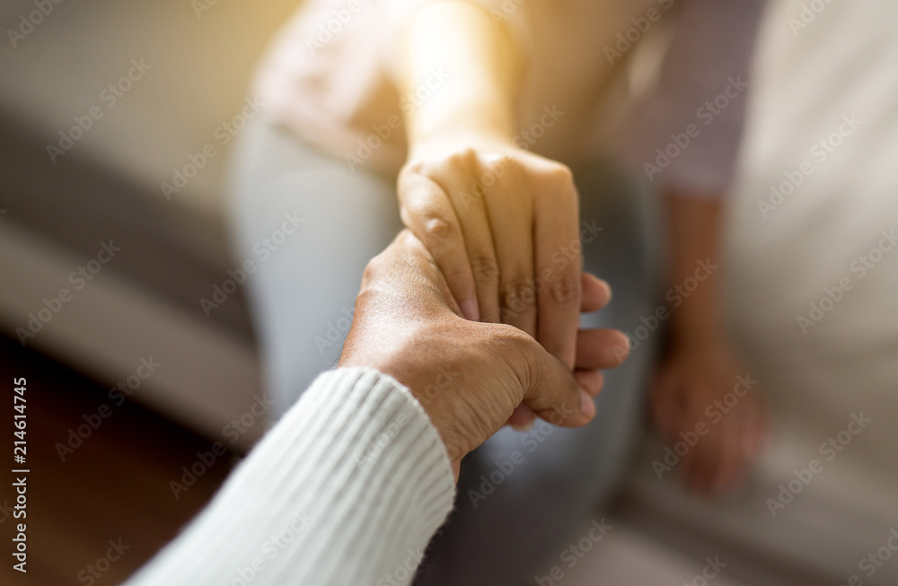 Foto de Man giving hand to depressed woman,Psychiatrist holding hands ...