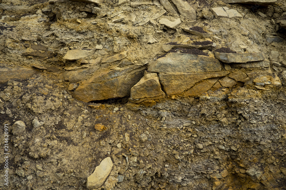 Soil cut-sandstone, stones, clay, sand structure and layers. slice of ...