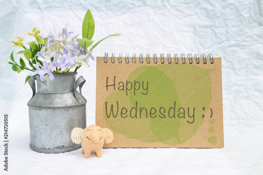 Happy Wednesday on design notebook cover with smiling elephant clay ...