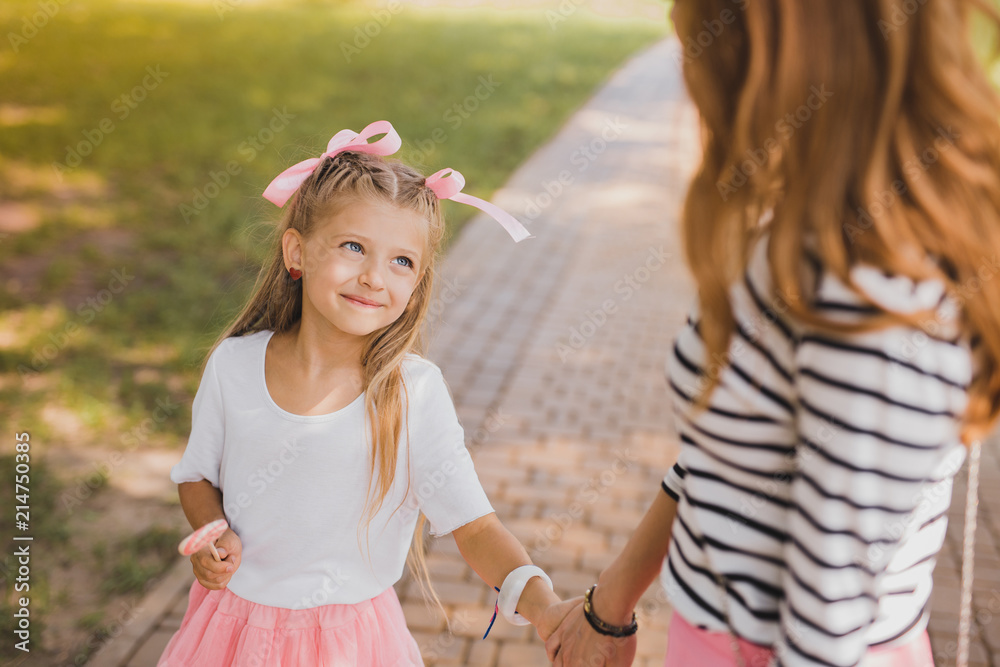 Appealing mother. Unbelievably cute loving daughter looking at her ...