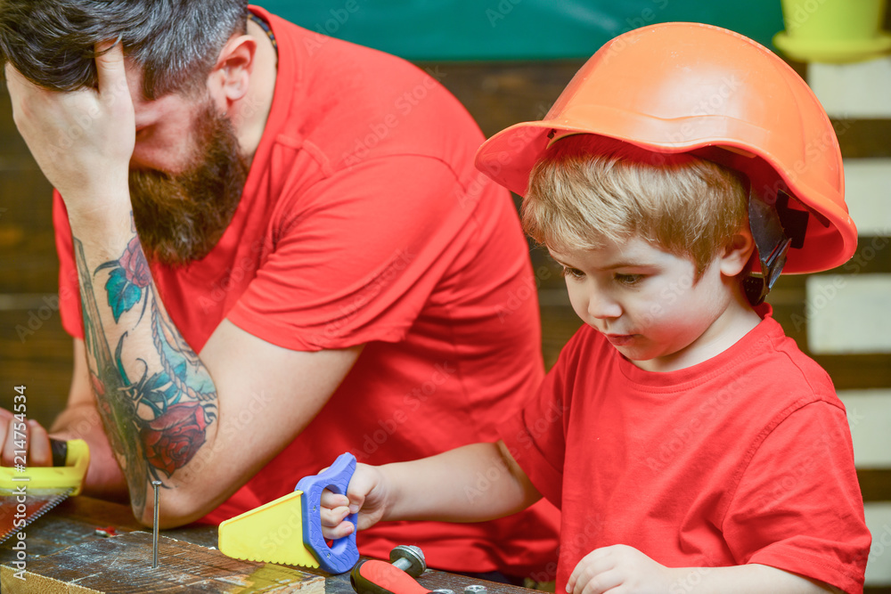 Educational games concept. Boy, child busy in protective helmet ...