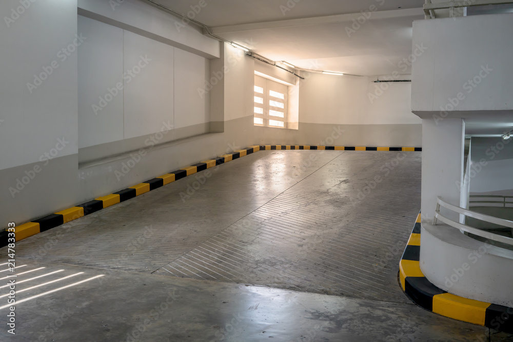 Concrete road and ramp with yellow and black curb Stock Photo | Adobe Stock