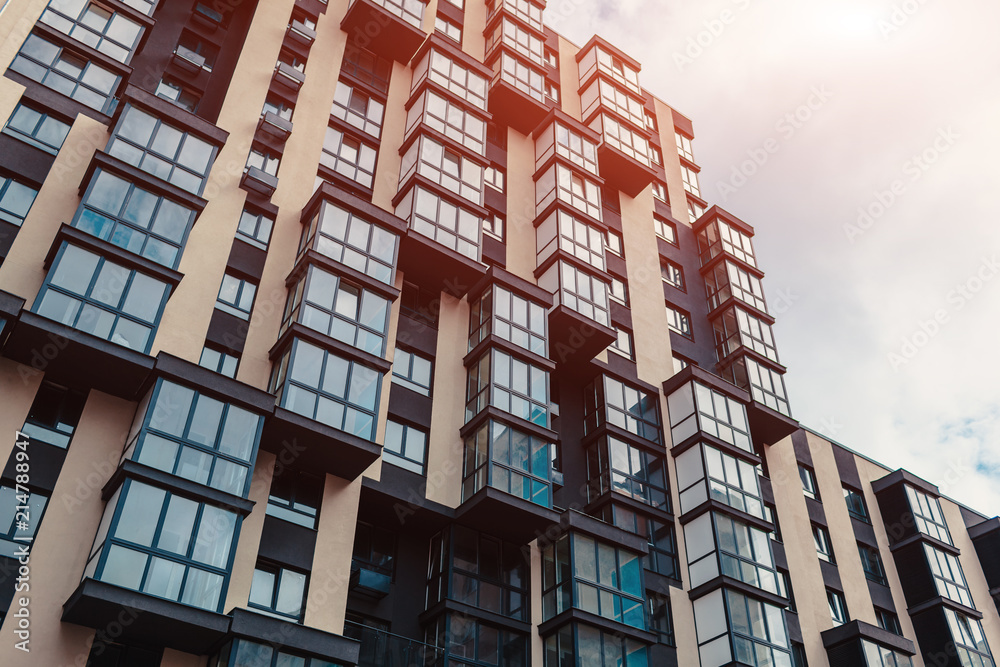 New multi-storey residential building. Modern house on sky background ...