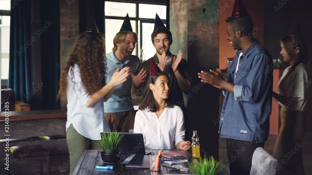 Pretty woman is working in modern office when her colleagues are ...