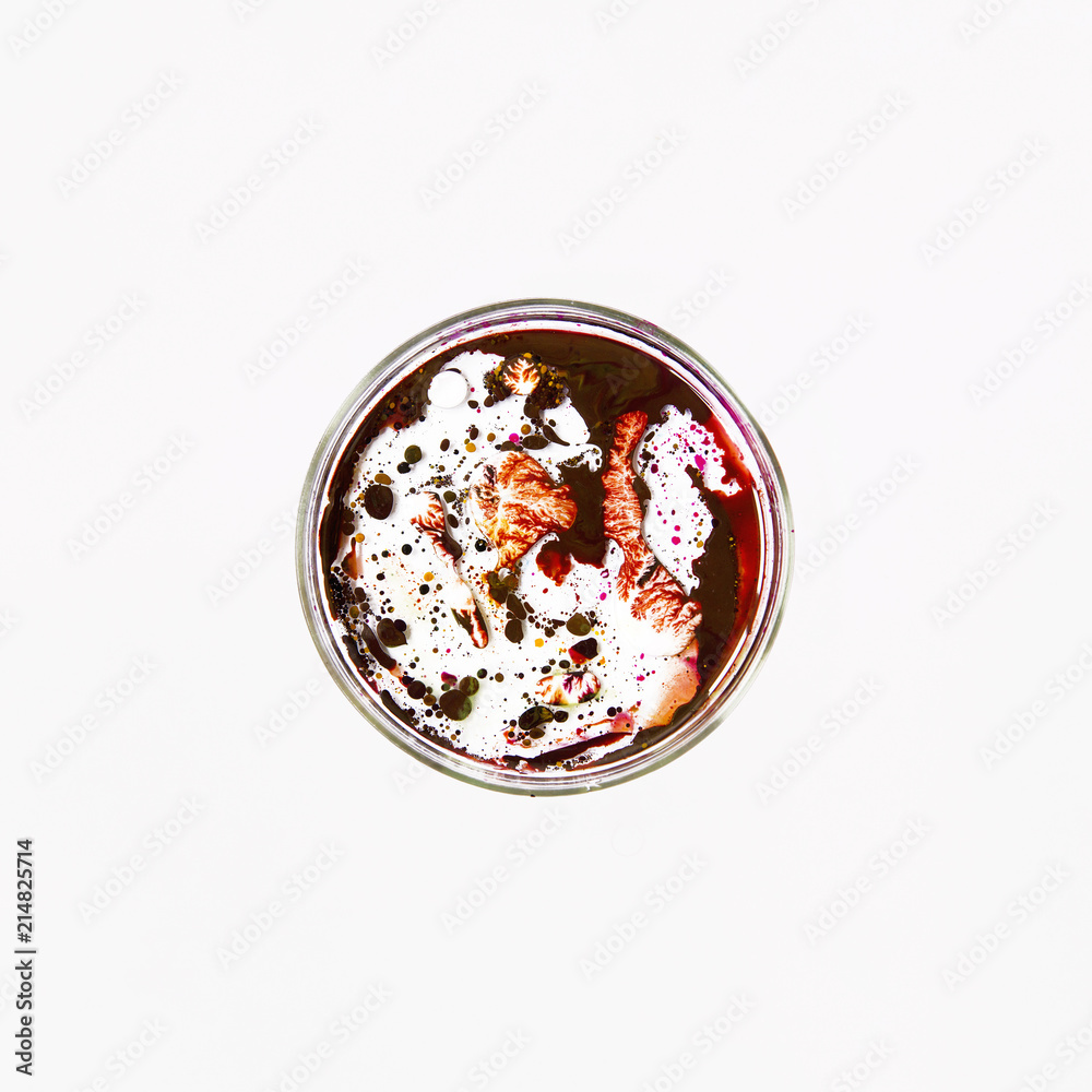 Fluid art in a petri dish. Colorful acrylic, ink, oil and watercolor ...