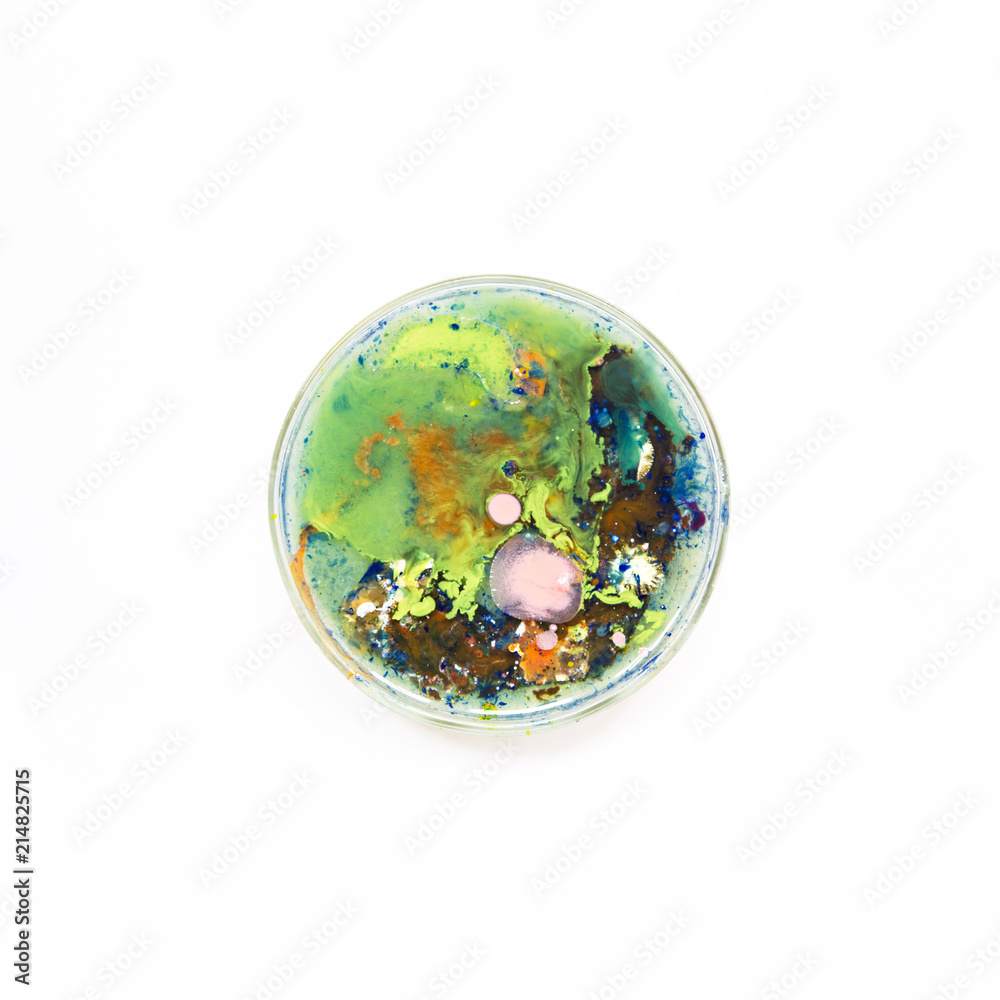 Fluid art in a petri dish. Colorful acrylic, ink, oil and watercolor ...