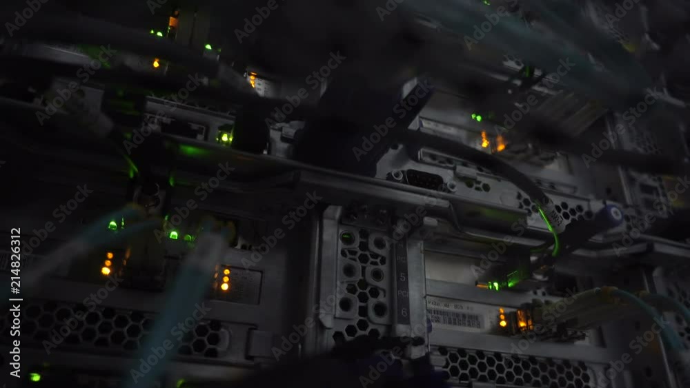 Ethernet Network Connection Hub. Blinking lights in a dark server room, Close-up view of ...