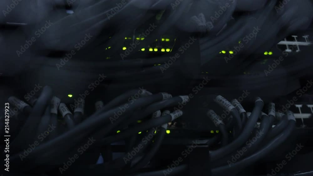 Ethernet Network Connection Hub. Blinking lights in a dark server room, Close-up view of ...