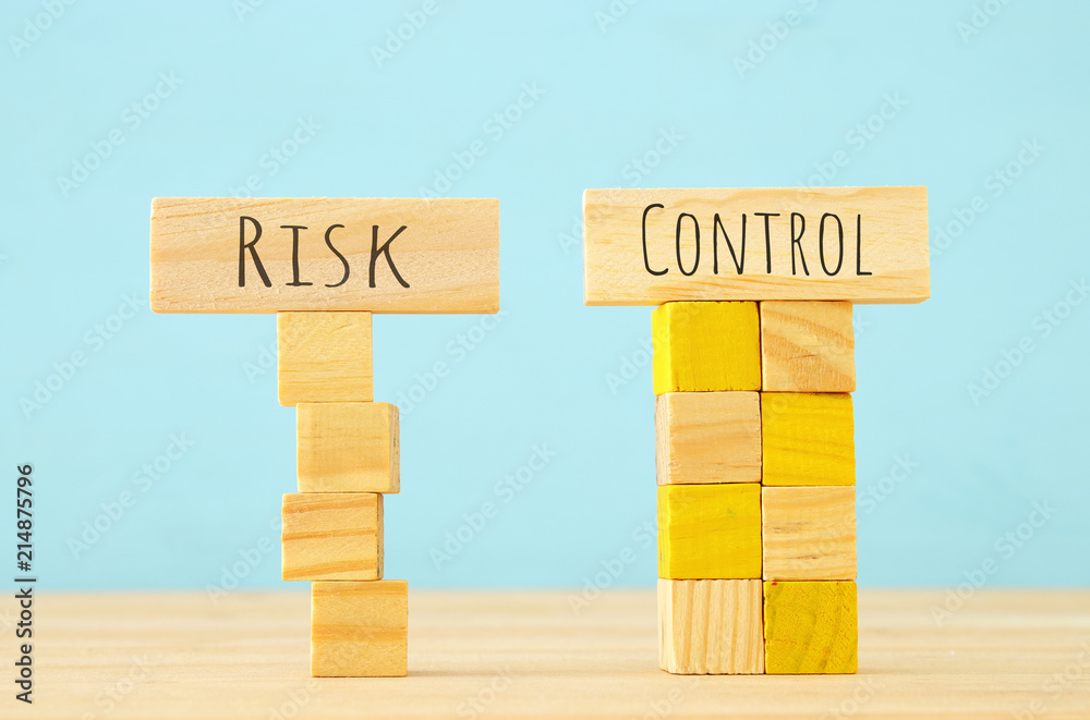 concept image of Wooden cubes that create an unstable structure and the ... concept image of Wooden cubes that create an unstable structure and the ...