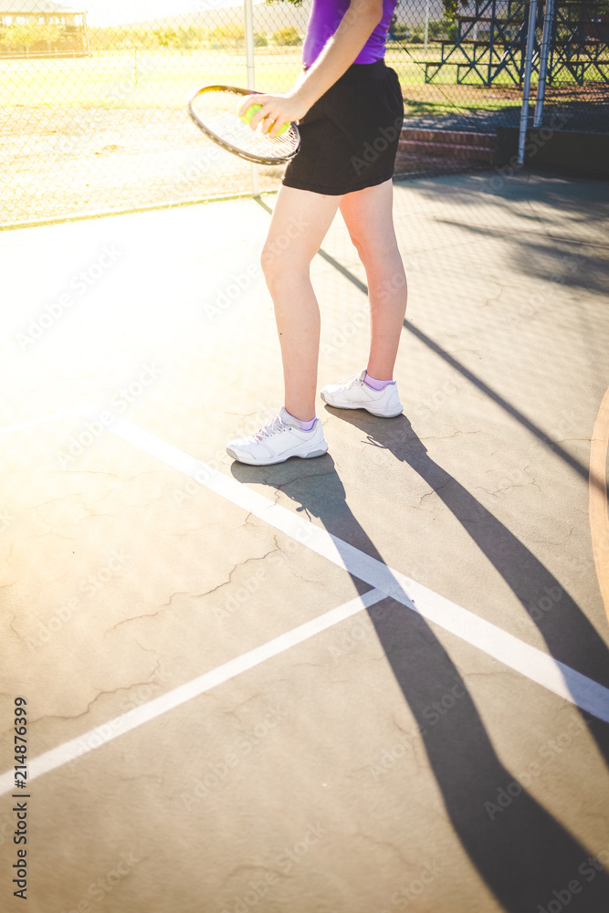 Close up image of a female tennis player playing tennis on a court in ...
